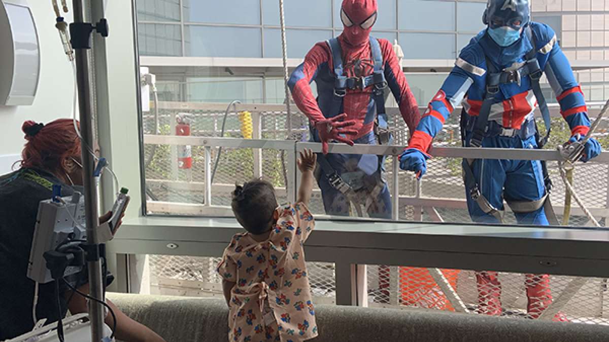 Superhero window washers fighting grime make hospitalized kids cheer ...